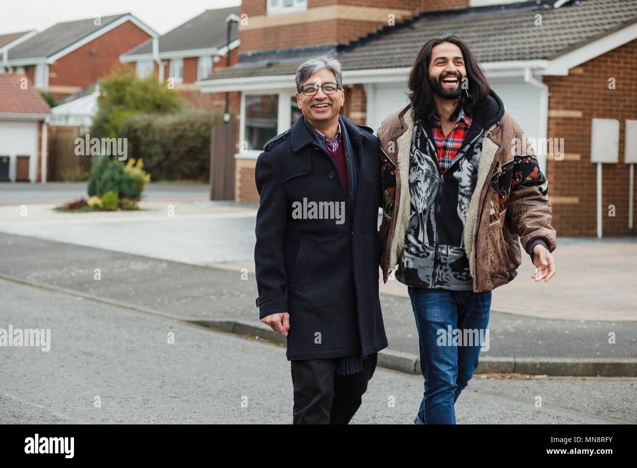 Asian man walking down the street hi-res stock photography and images ...