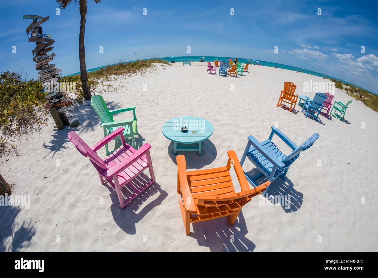 Fisheye lens view of colorful chairs on the Gulf of Mexico beach at the ...