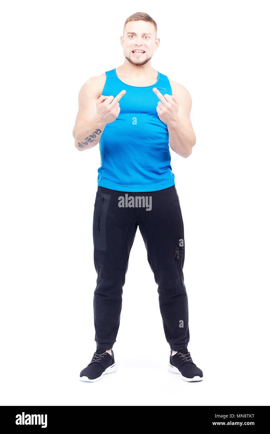 Portrait of well-muscled man giving middle finger at camera Stock Photo ...
