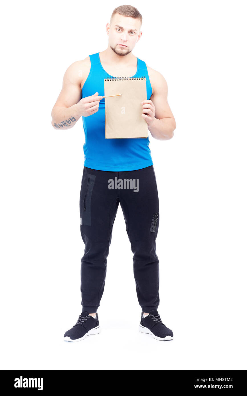 Portrait of sports trainer showing blank sheet of notebook paper at ...