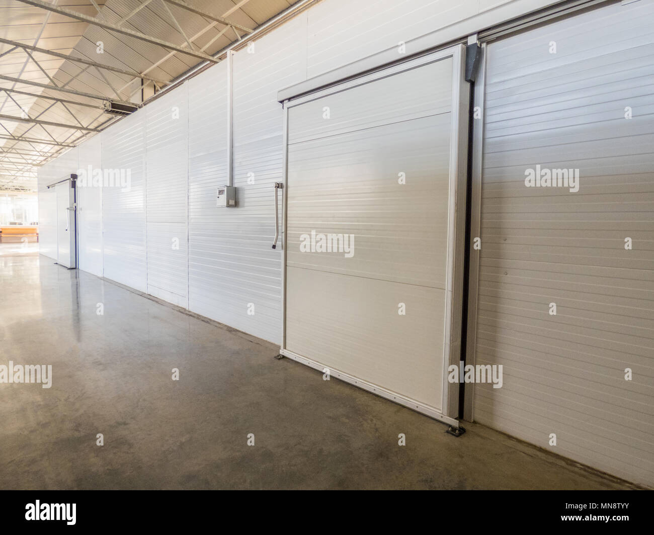 large freezer storage in the factory. closed door from warehouse Stock ...