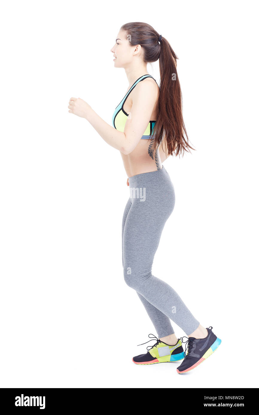 Isolated full length portrait of fit girl running or jogging Stock ...