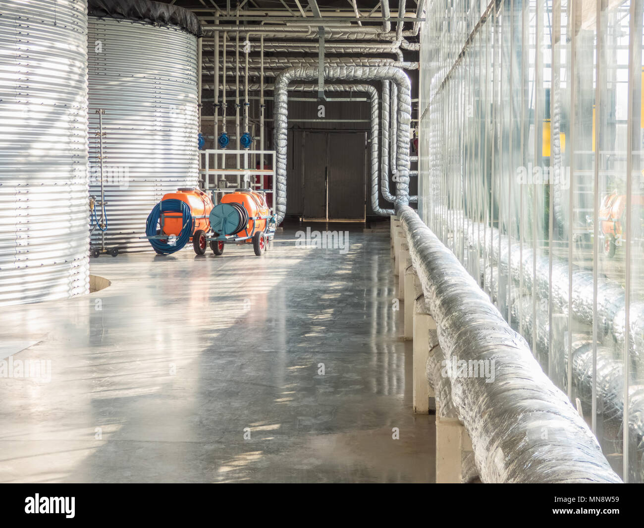 the pipeline and water tank in the industry Stock Photo - Alamy