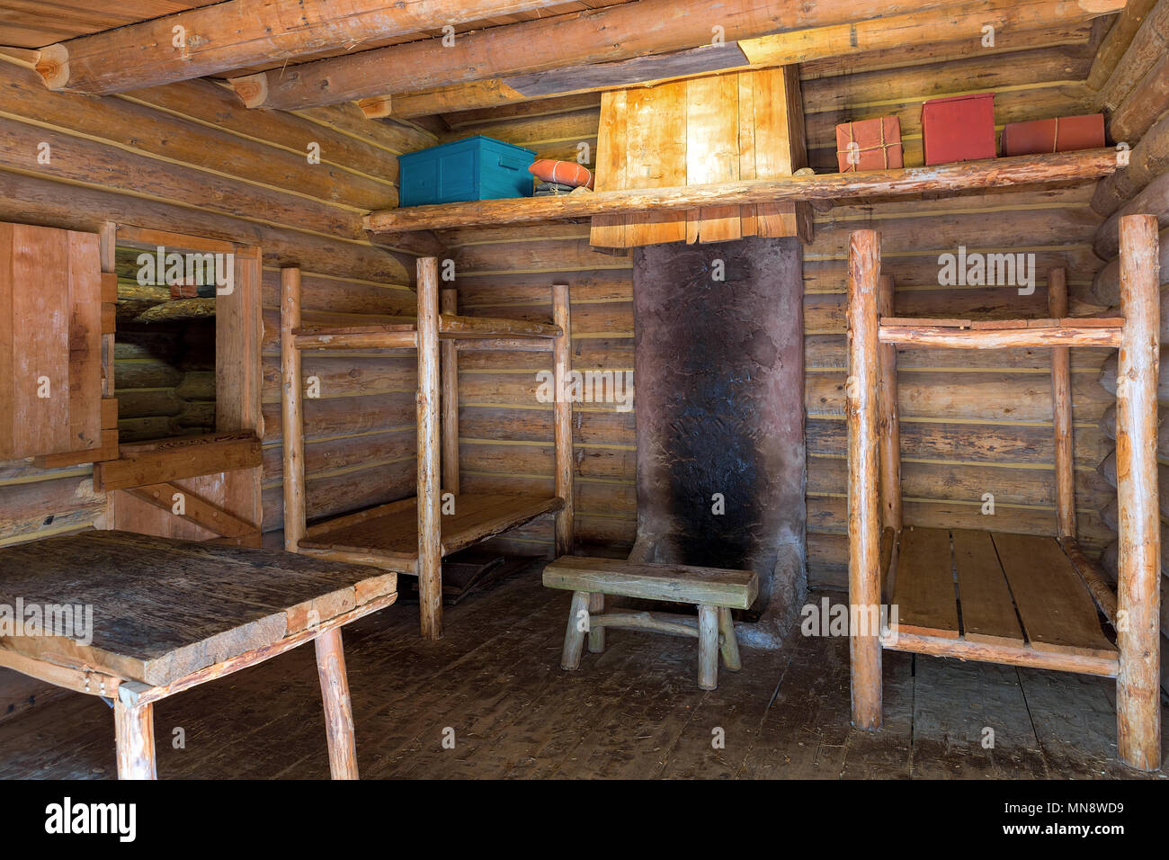 Fort Clatsop Log Cabin living quarters with bunk beds table and chair ...