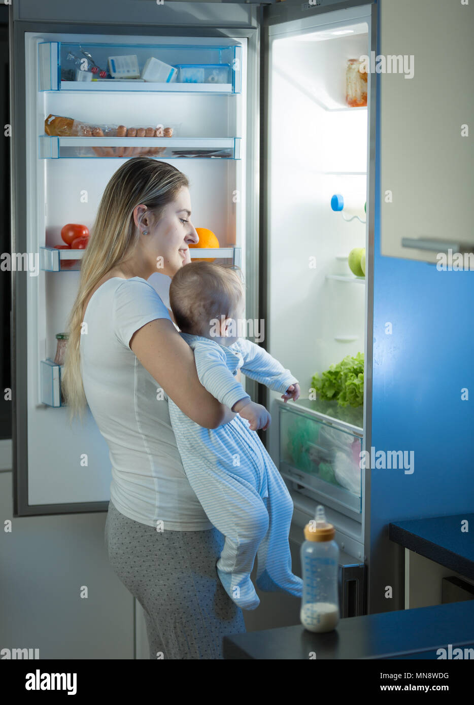 Boy looking in refrigerator hi-res stock photography and images - Alamy