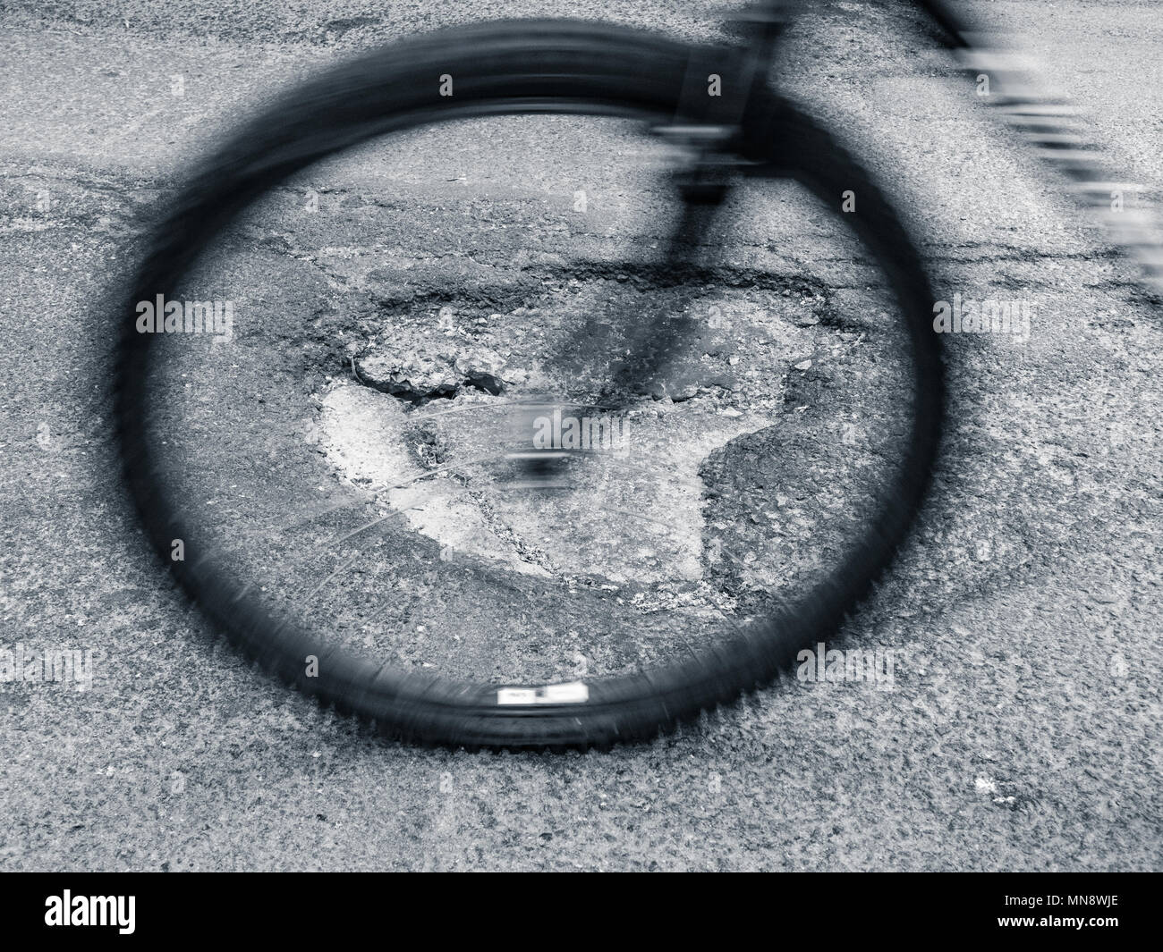 Potholes cyclist hi-res stock photography and images - Alamy