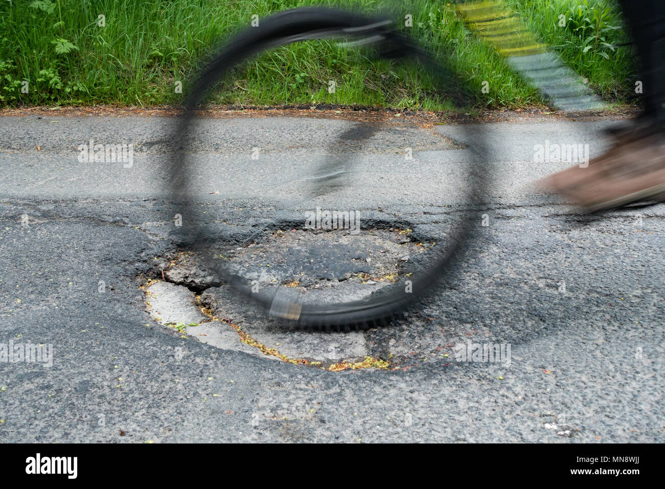 Potholes cyclist hi-res stock photography and images - Alamy