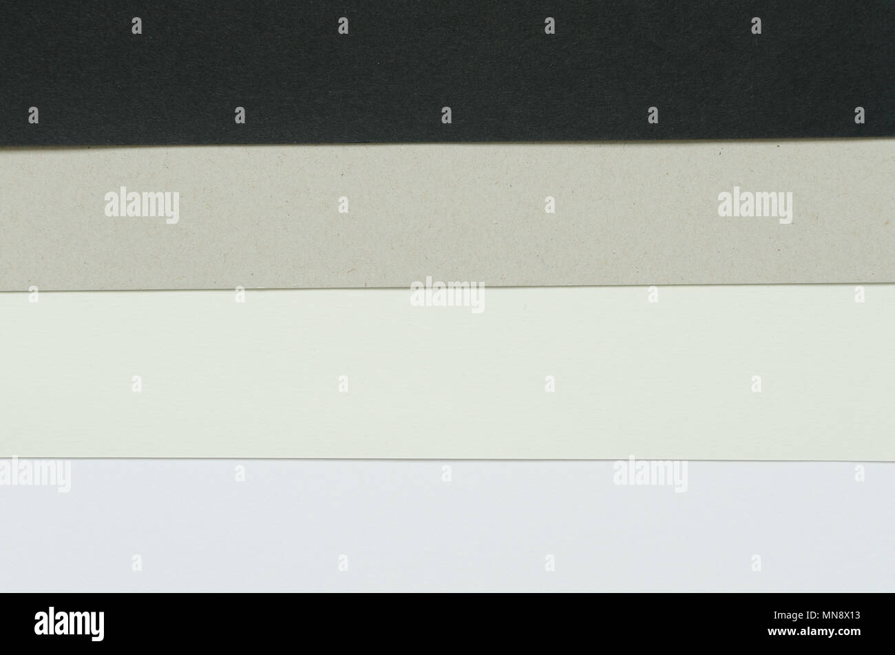 construction paper sheets arranged horizontally from black to white ...