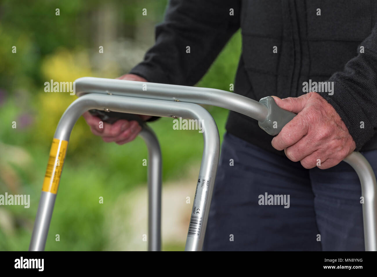 Using walking frame using walking aid hi-res stock photography and ...