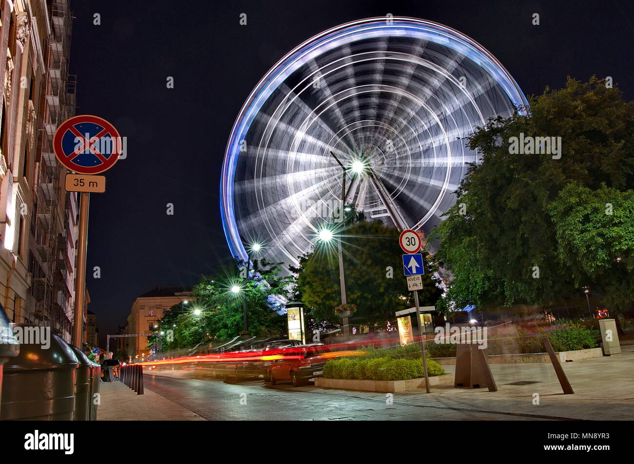 Big wheel spinning at night Stock Photo - Alamy