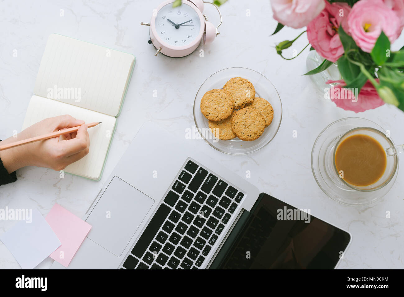 Beautiful woman's workplace. Laptop, cookies, flowers. Flat lay Stock ...