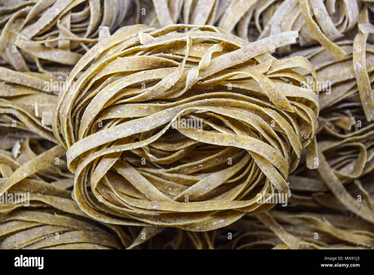 Fresh Pasta, close-up texture of Home made tagliatelle pasta flour ...