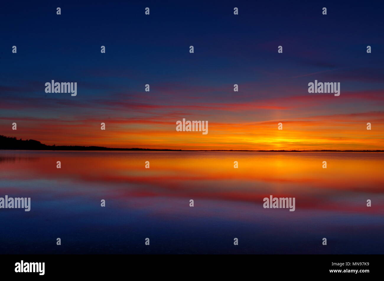 A peaceful sunset over the sea Stock Photo - Alamy