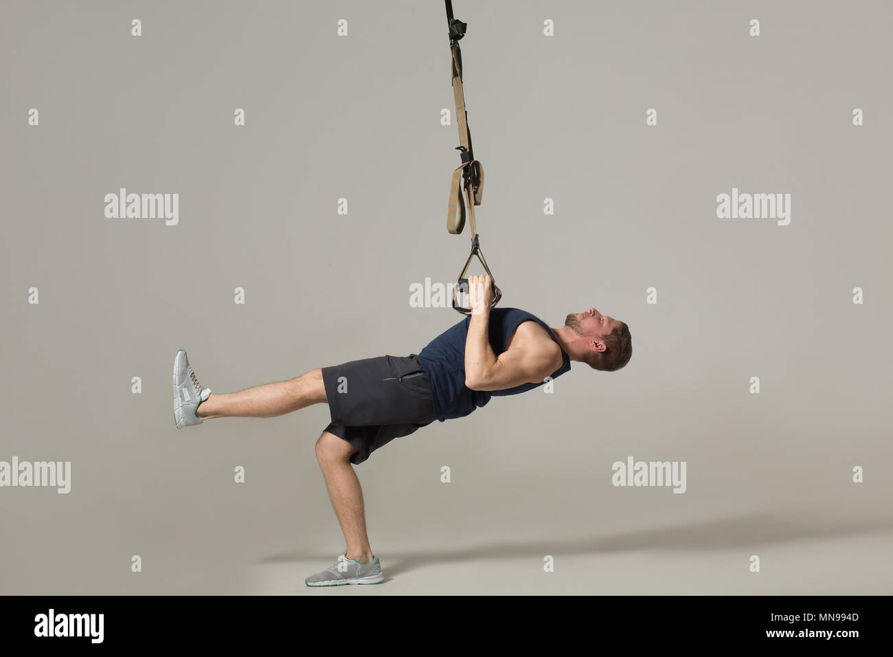 Young sporty man doing exercises hi-res stock photography and images ...