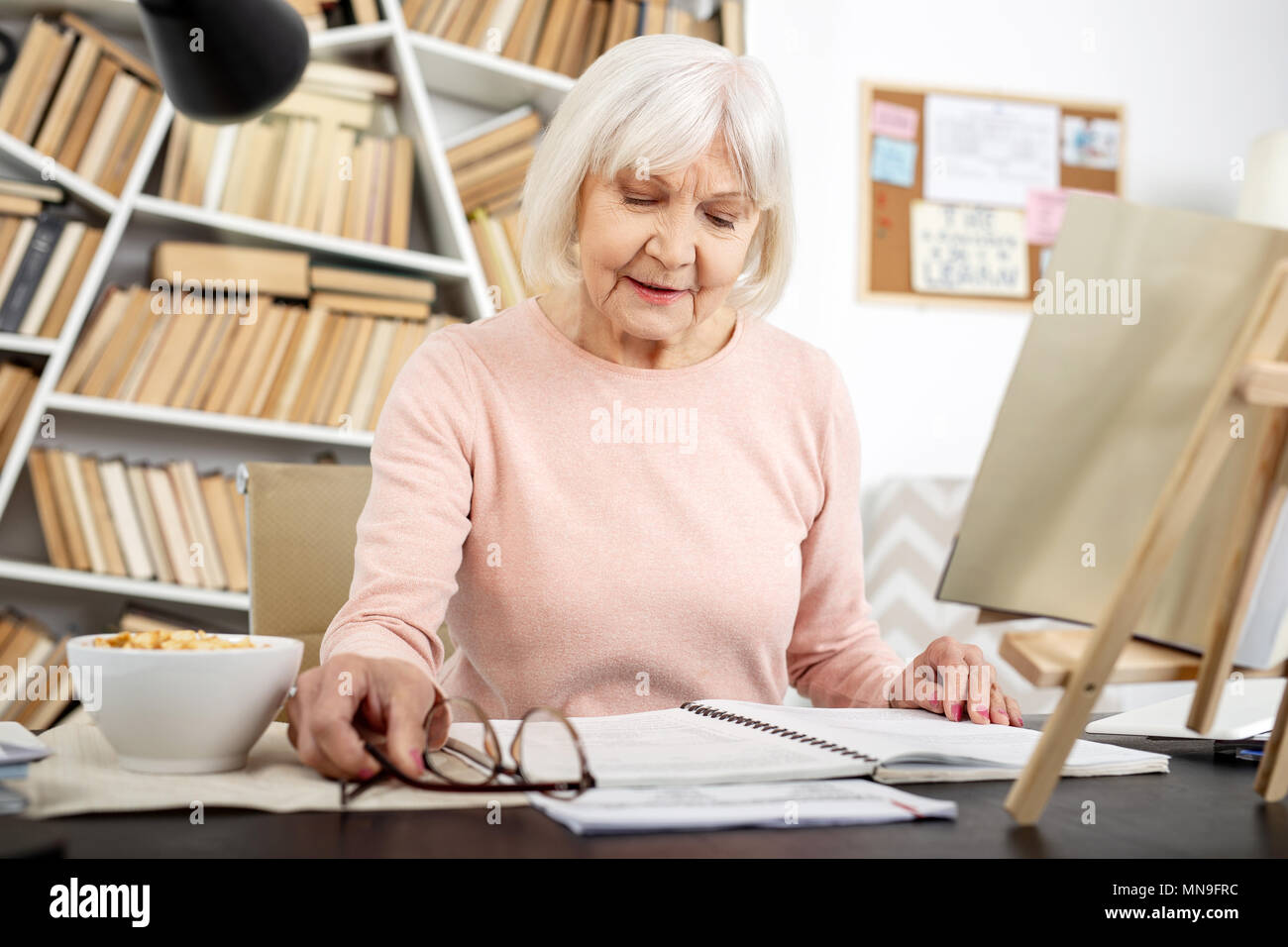 Thoughtful senior woman reading notes Stock Photo - Alamy