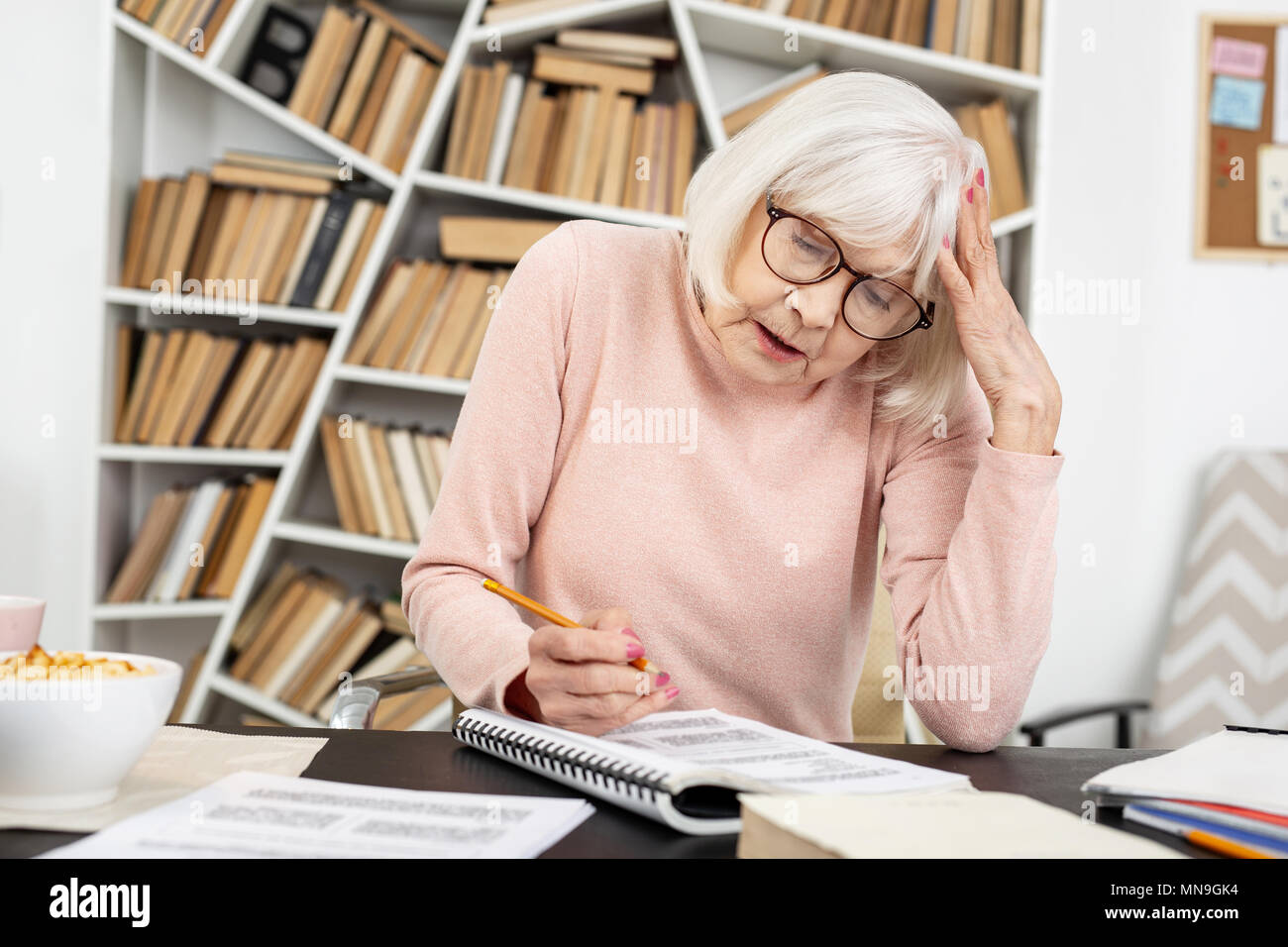Attractive mature woman facing problem Stock Photo - Alamy