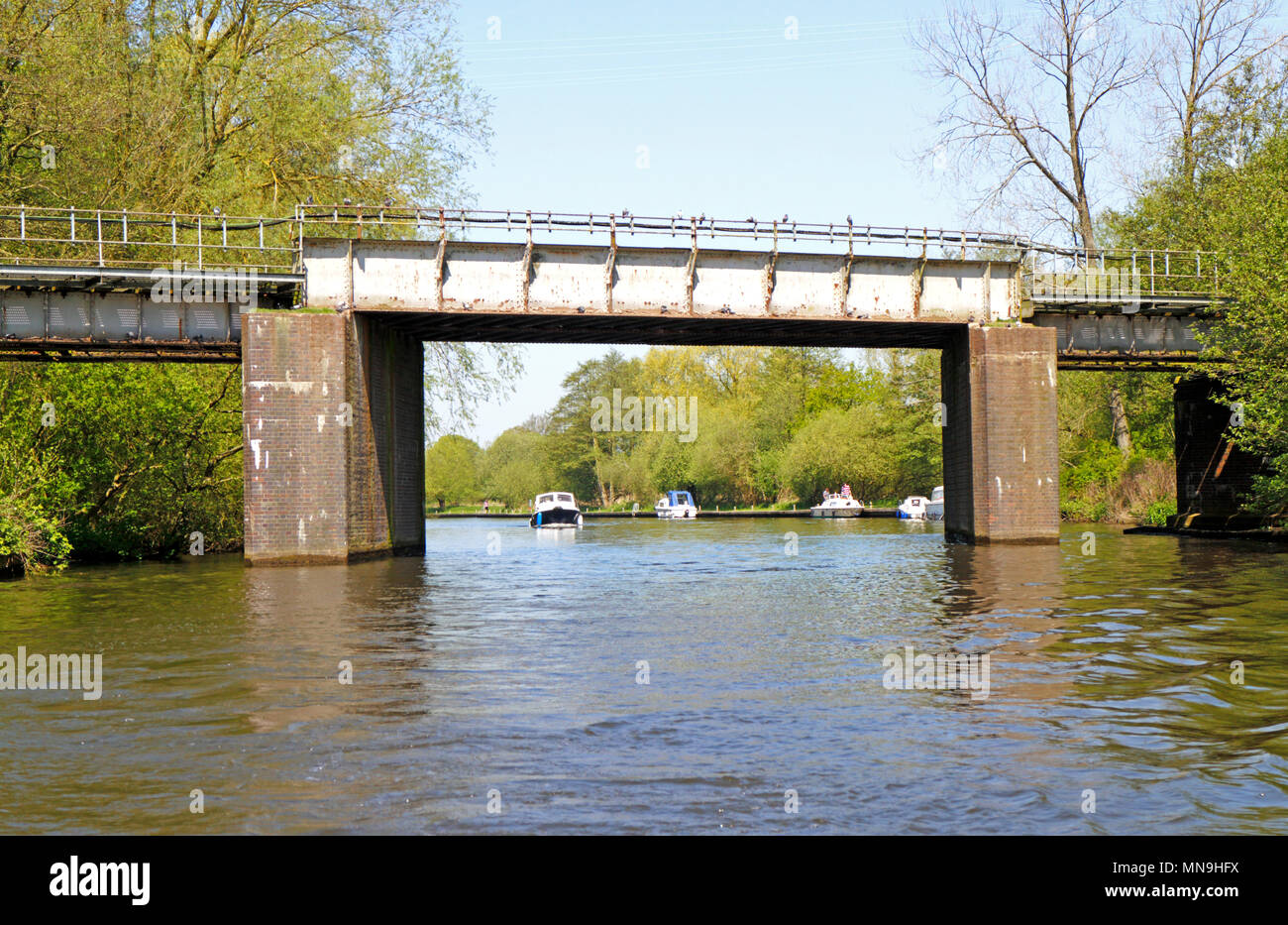 The Bittern Line rail bridge over the River Bure on the Norfolk Broads ...