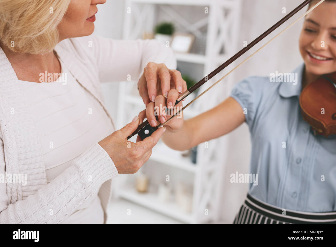 Close up of female hand that helping her student Stock Photo - Alamy