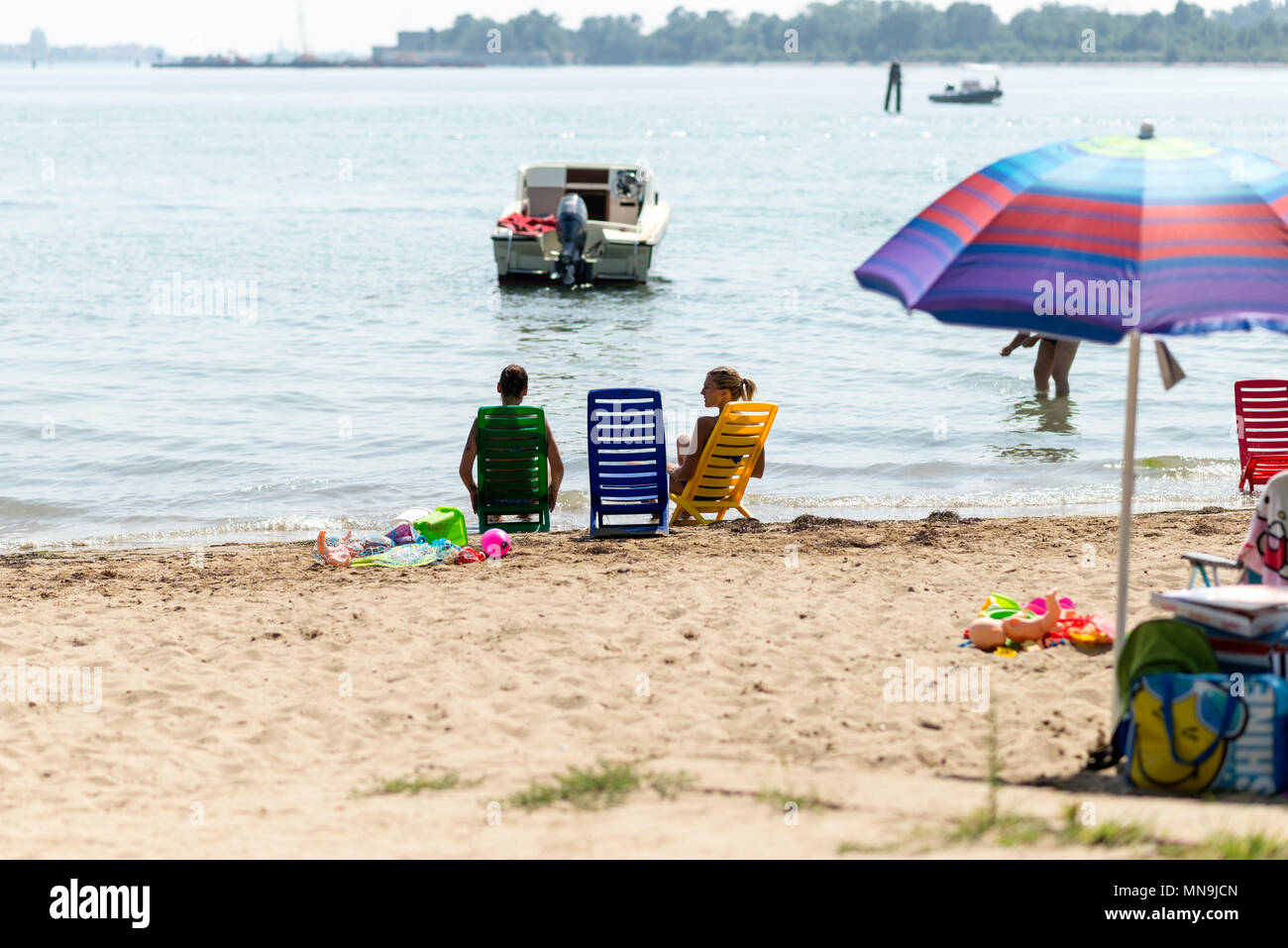 Catching rays at the local's beach in Venice Stock Photo - Alamy