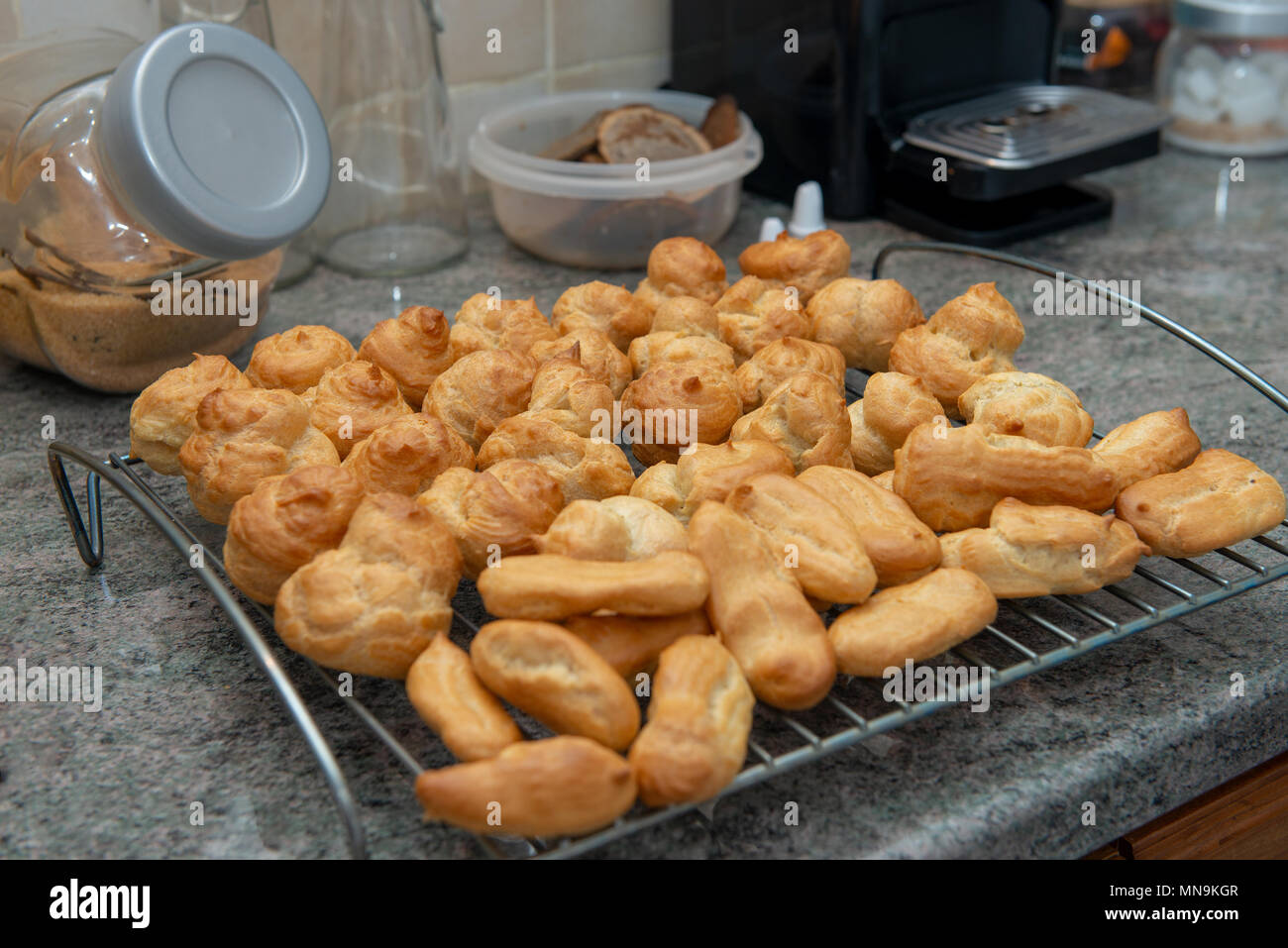 a preparation of the small cream puffs Stock Photo - Alamy