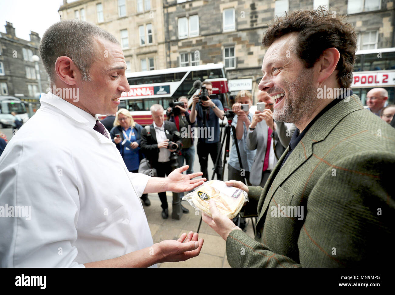Actor and social campaigner Michael Sheen receives a steak pie from ...