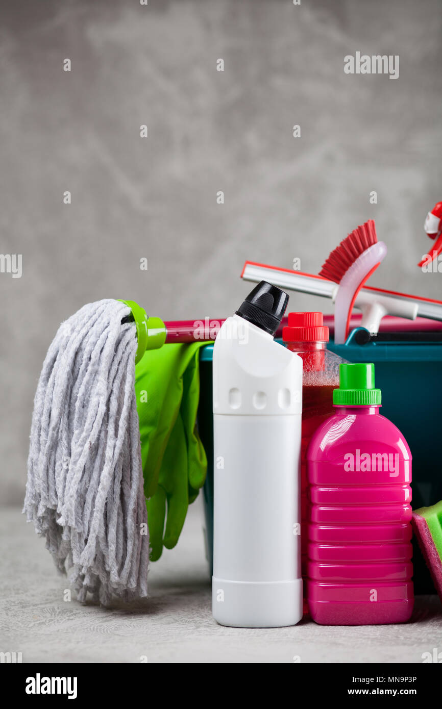 Set of cleaning supplies on grey background Stock Photo - Alamy