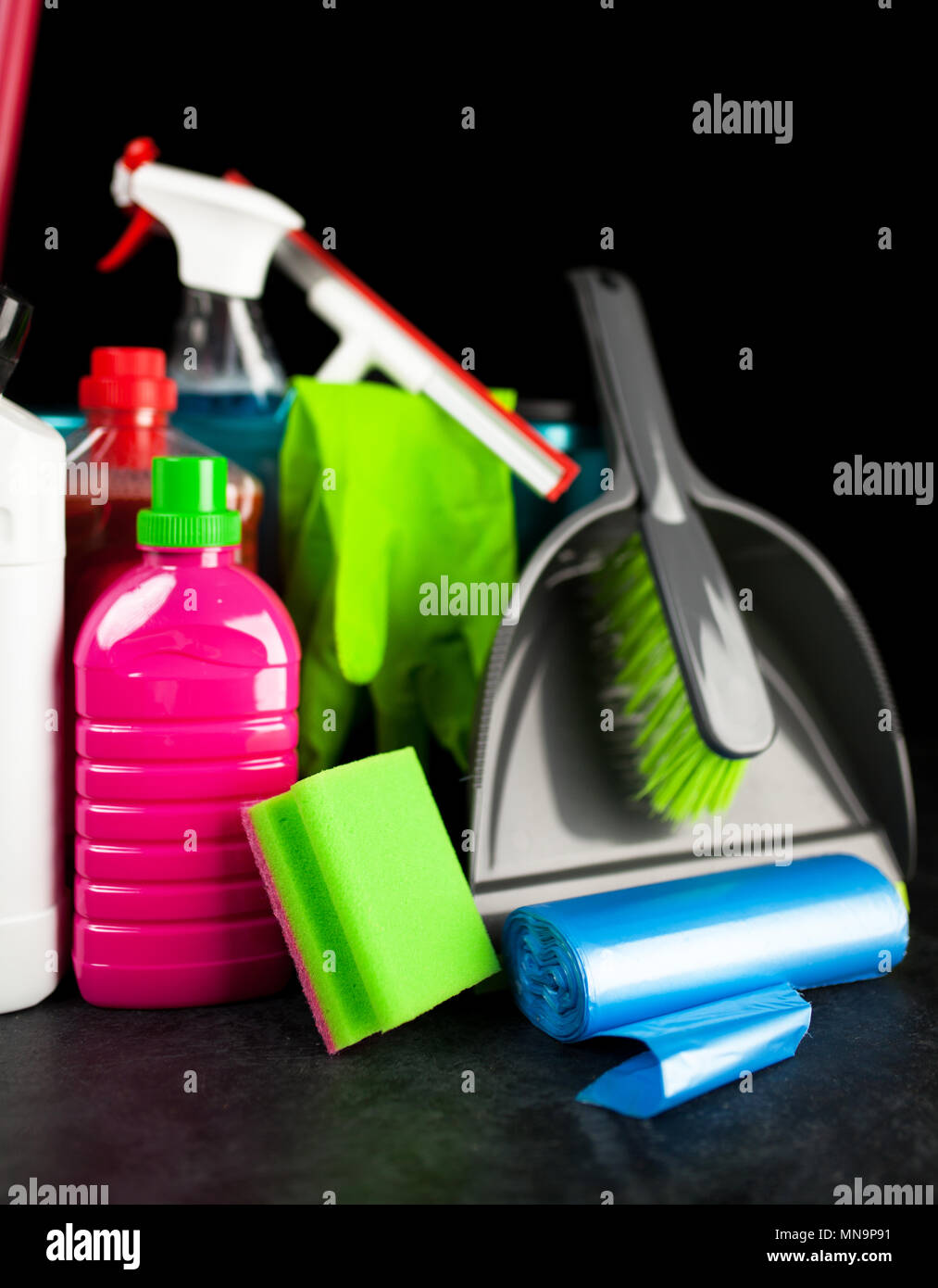 Set of cleaning supplies isolated on black background Stock Photo - Alamy