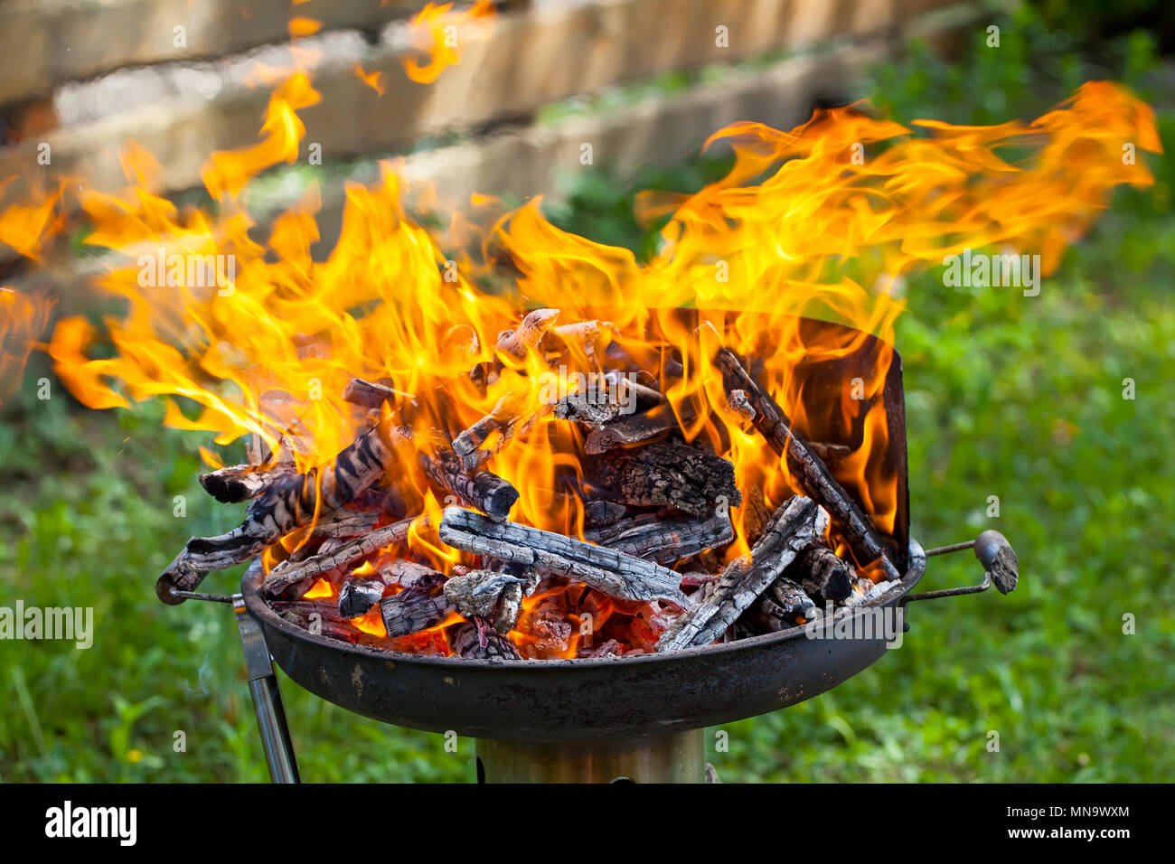 Close up picture of fire on a barbeque - preparation for cookout ...