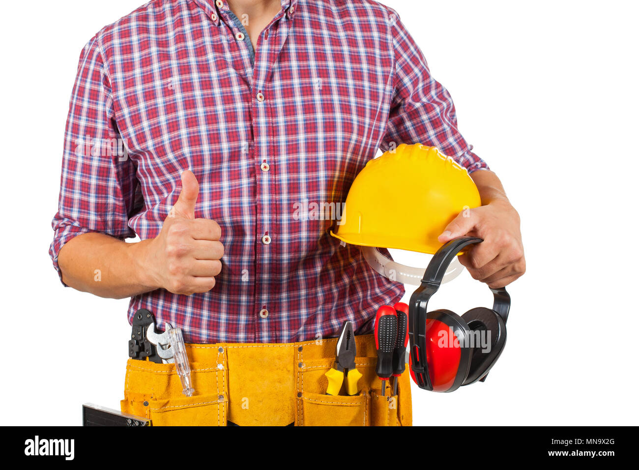Close up picture of carpenter with yellow tool belt holding safety ...