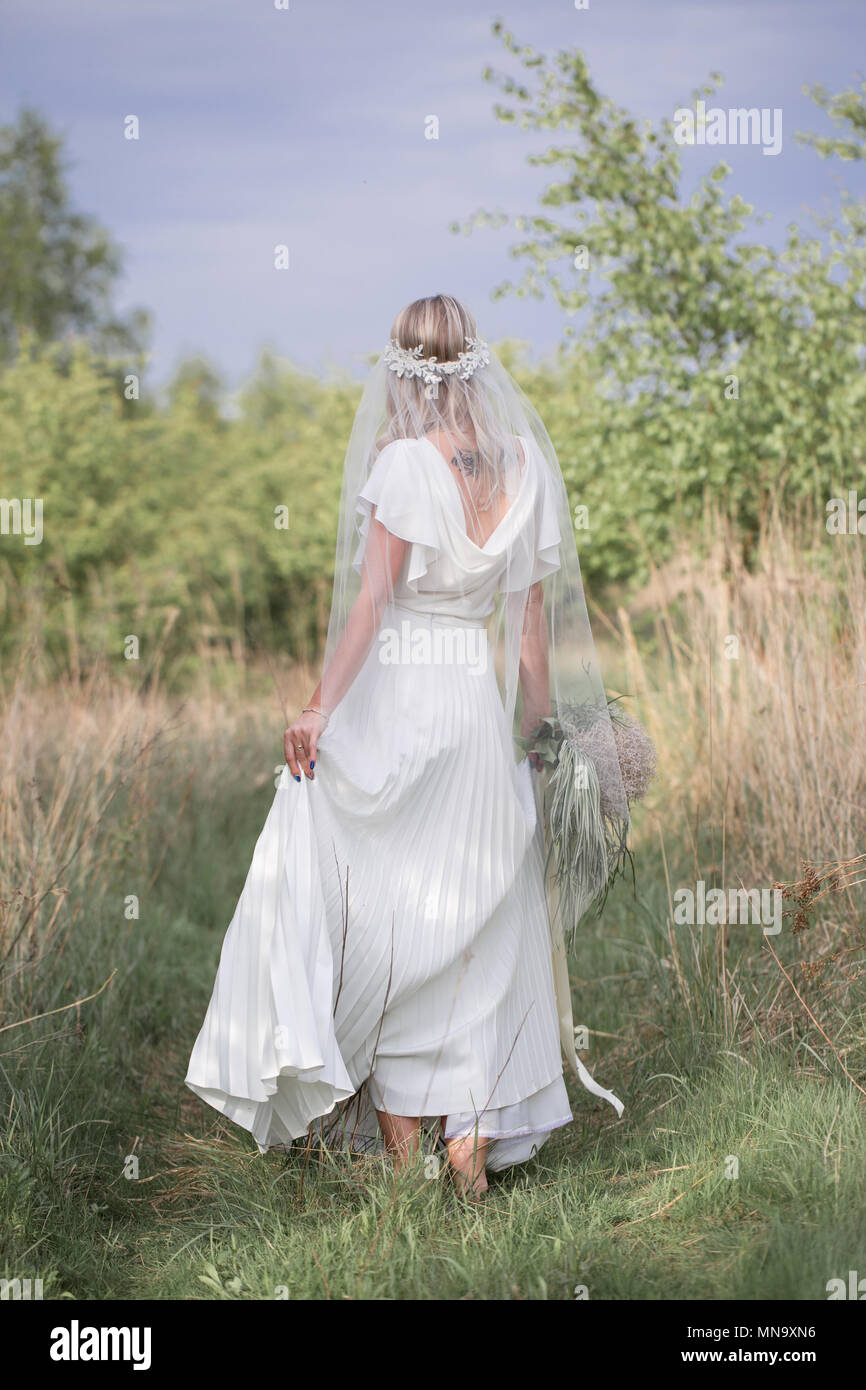Beautiful woman - the bride. Boho style woman. Barefoot beautiful woman ...