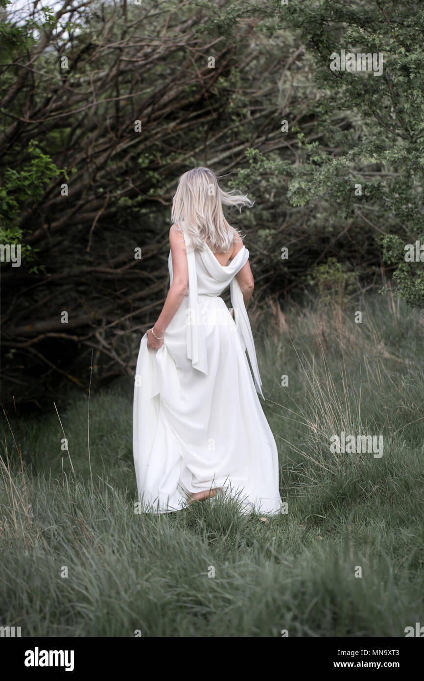 Beautiful woman - the bride. Boho style woman. Barefoot beautiful woman ...