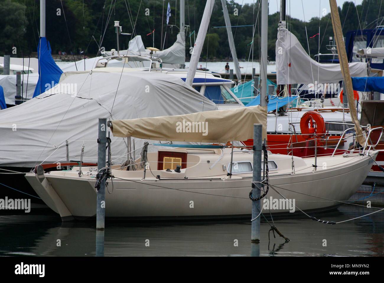 harbor scene with close up of colorful sailing boats at a pier Stock ...
