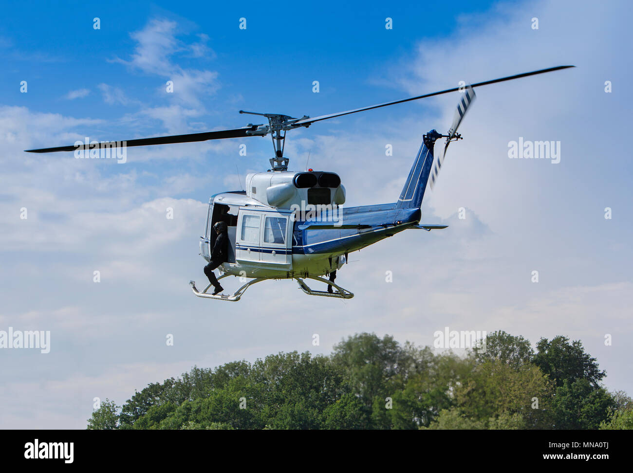 Special forces in helicopter in a low flight Stock Photo - Alamy