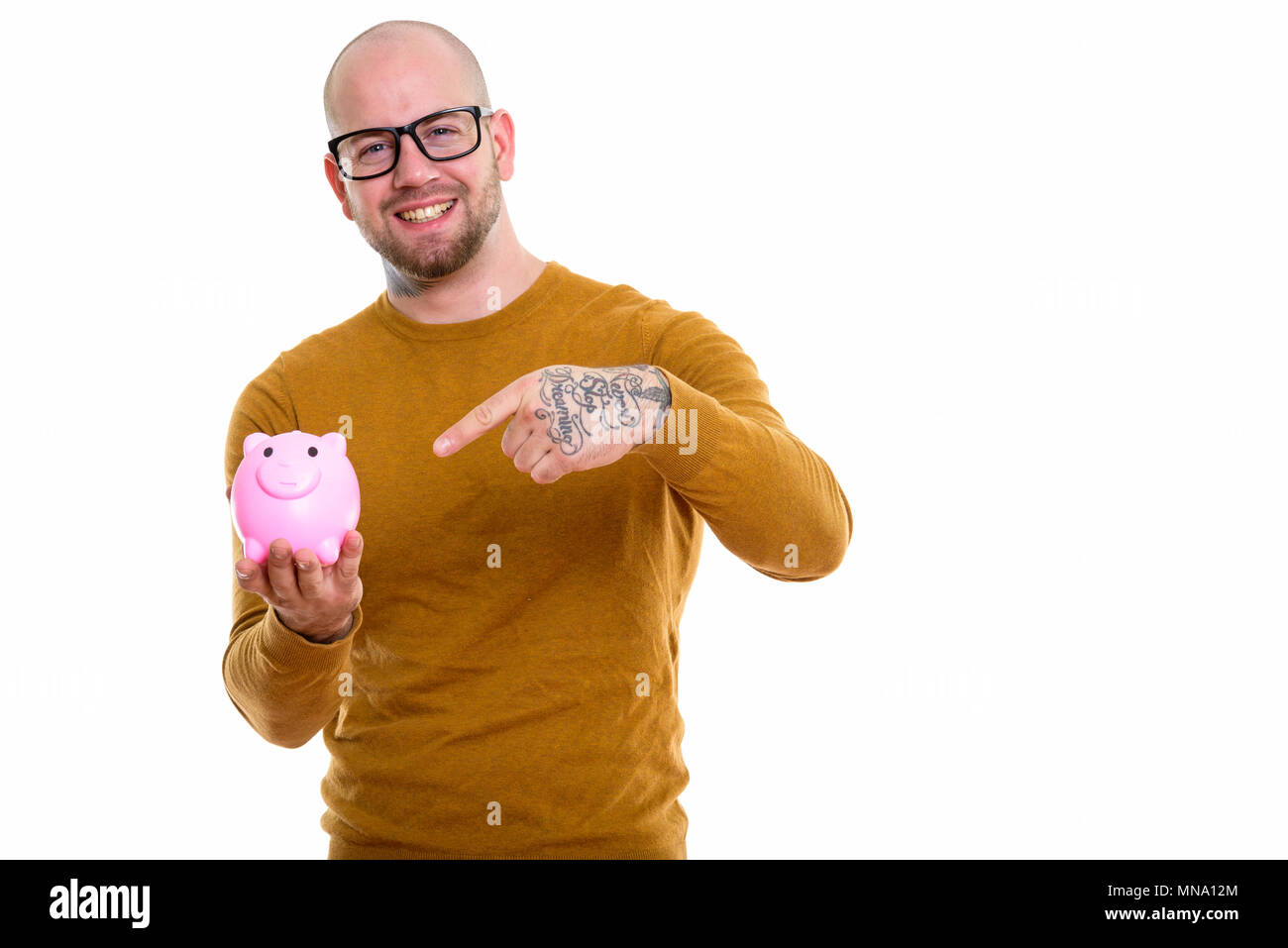 Studio shot of young bald muscular man Stock Photo - Alamy