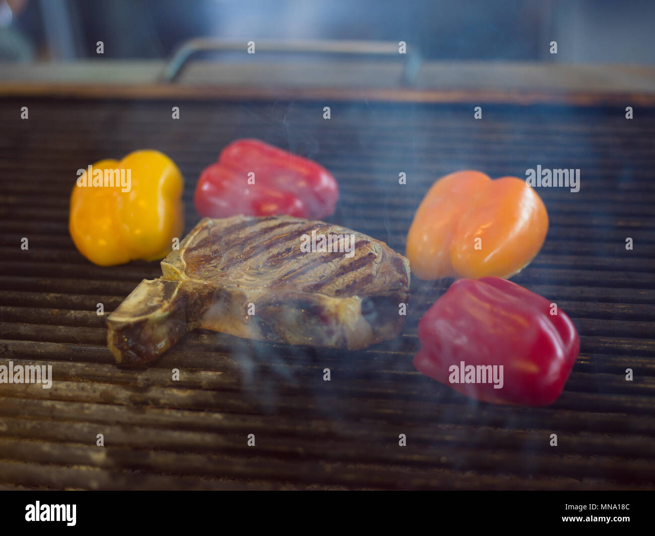 delicious grilled meat steak with vegetables on a barbecue Stock Photo ...