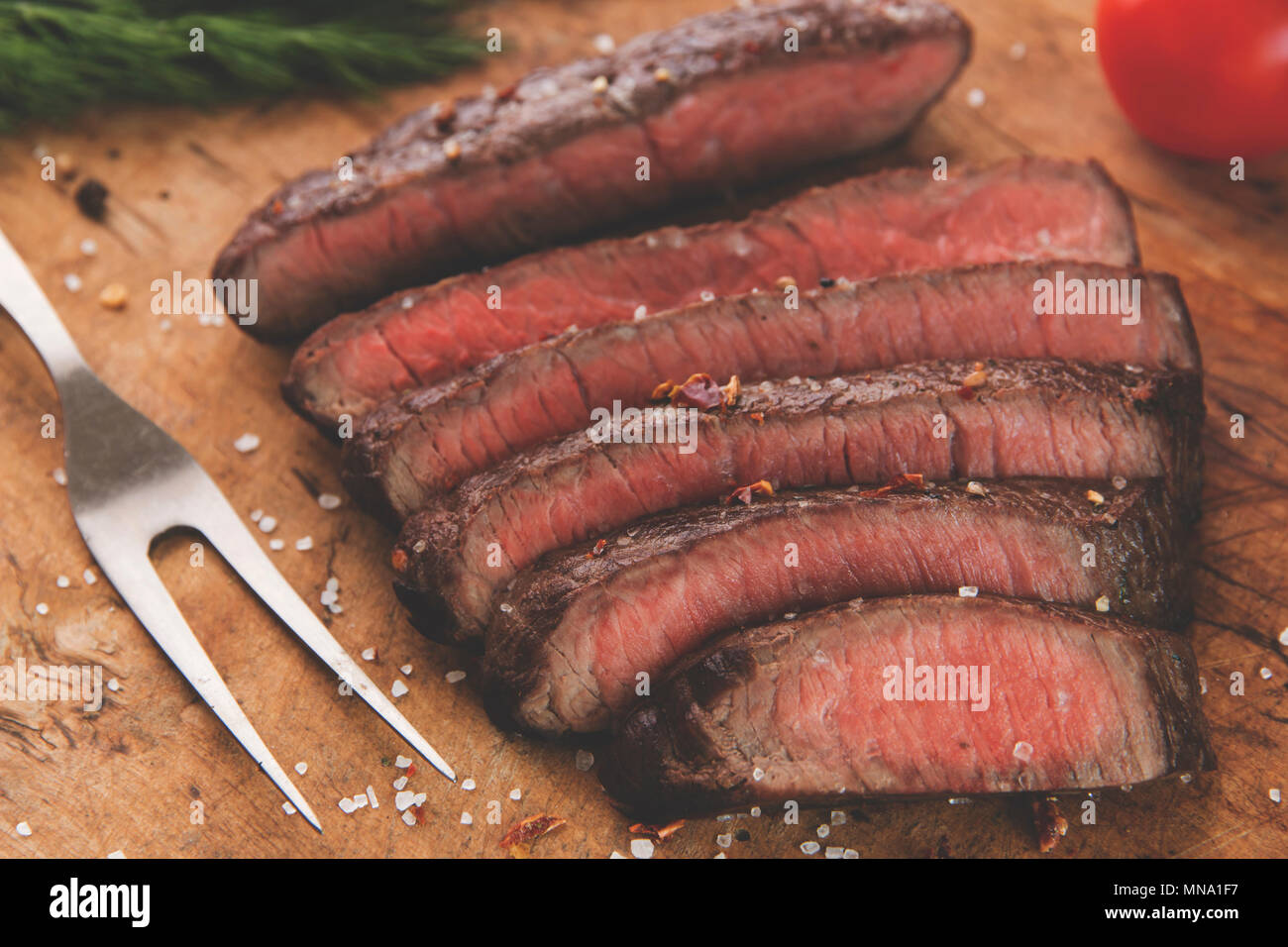 cooked beef steak sliced medium rare close-up Stock Photo - Alamy