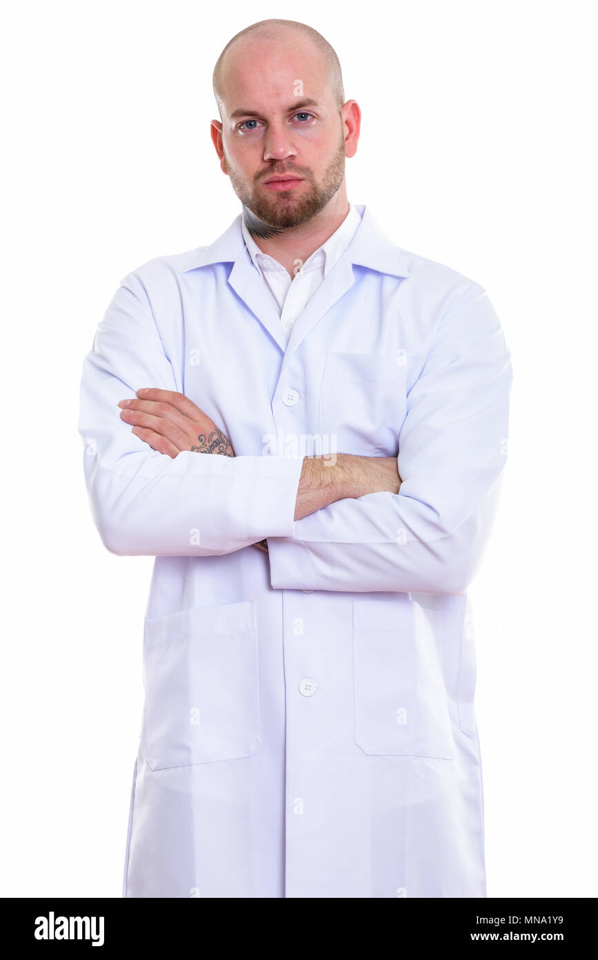 Studio shot of young bald muscular man doctor Stock Photo - Alamy