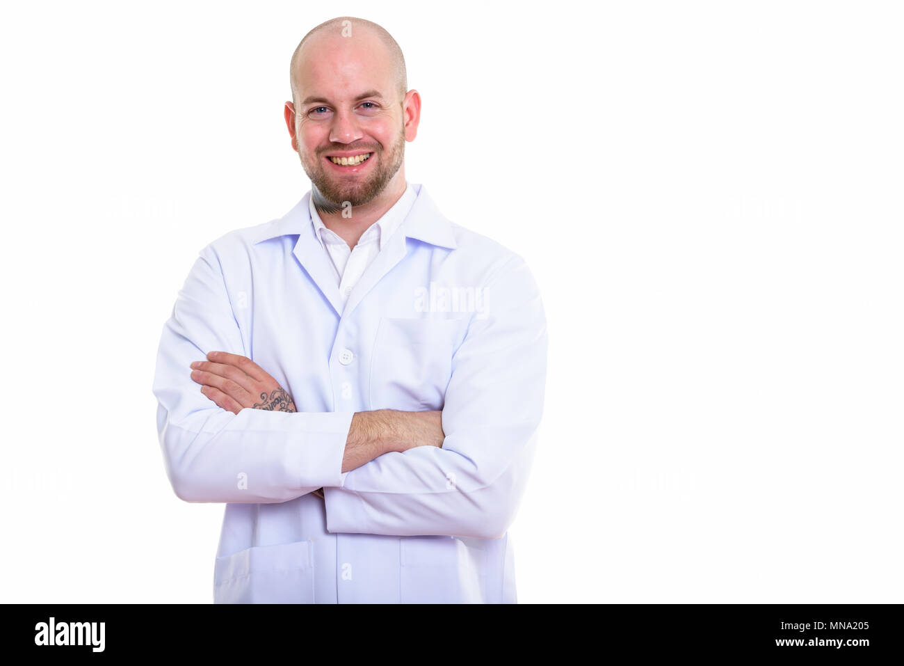 Studio shot of young bald muscular man doctor Stock Photo - Alamy