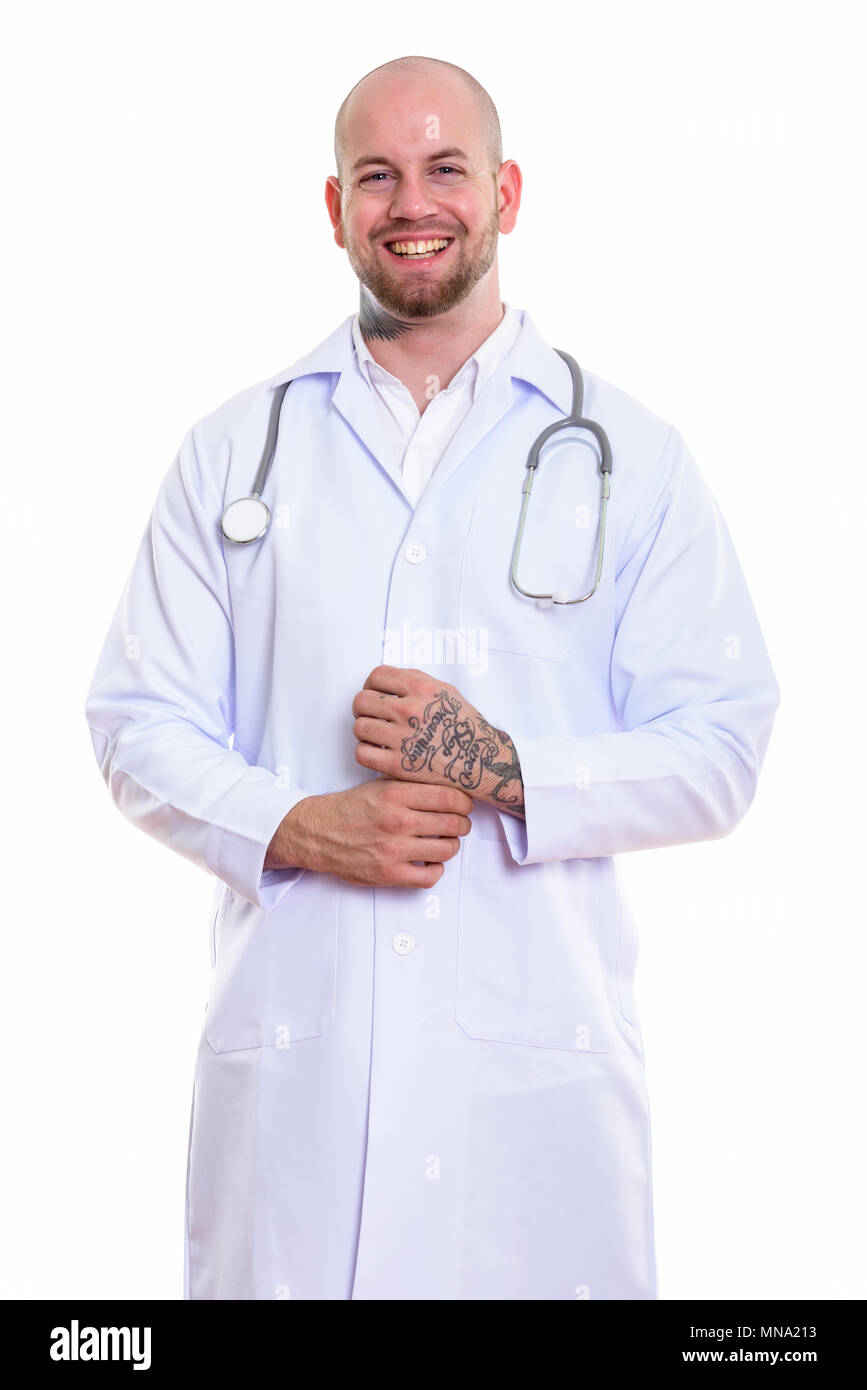 Studio shot of young bald muscular man doctor Stock Photo - Alamy