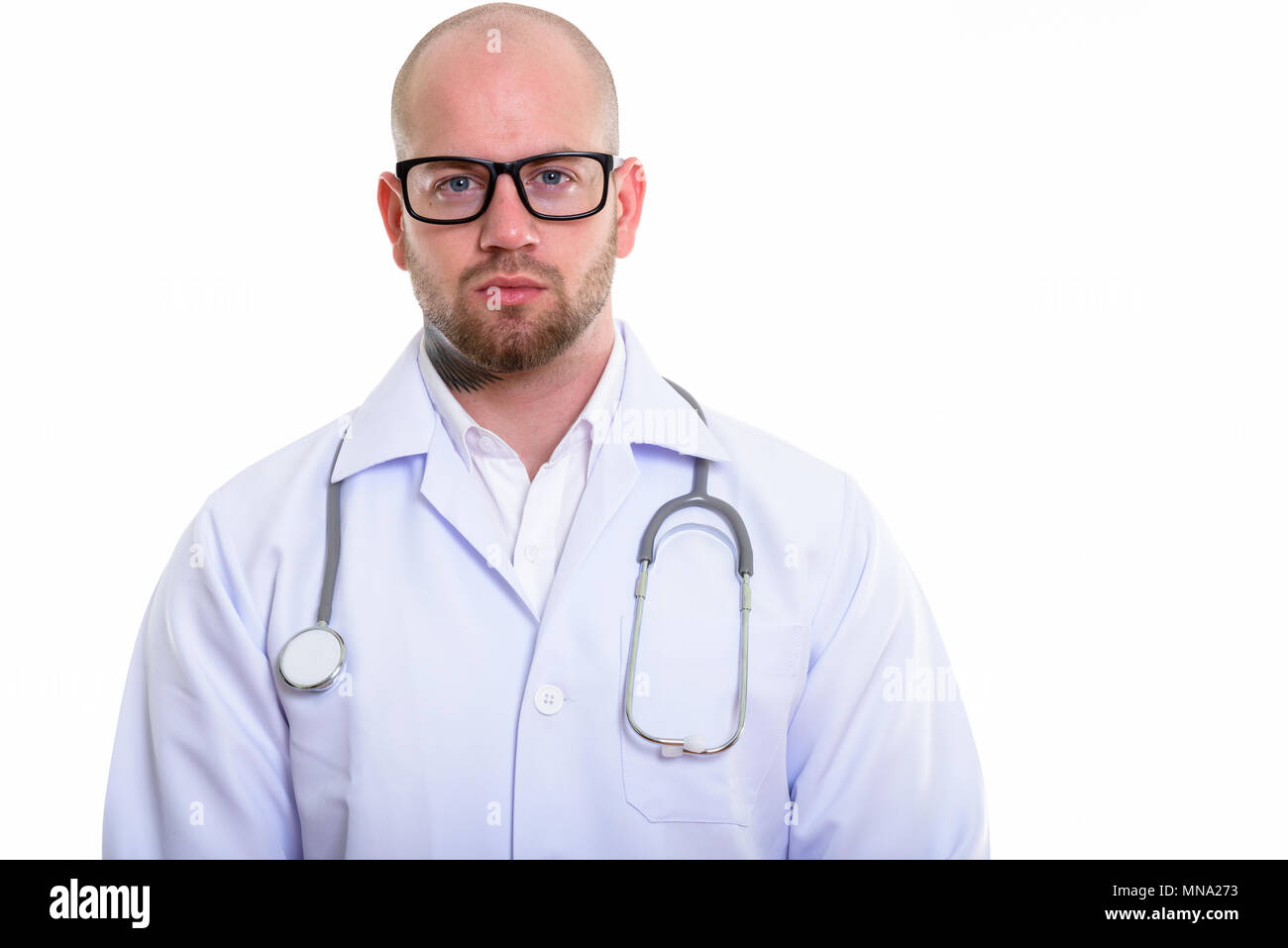 Studio shot of young bald muscular man doctor Stock Photo - Alamy