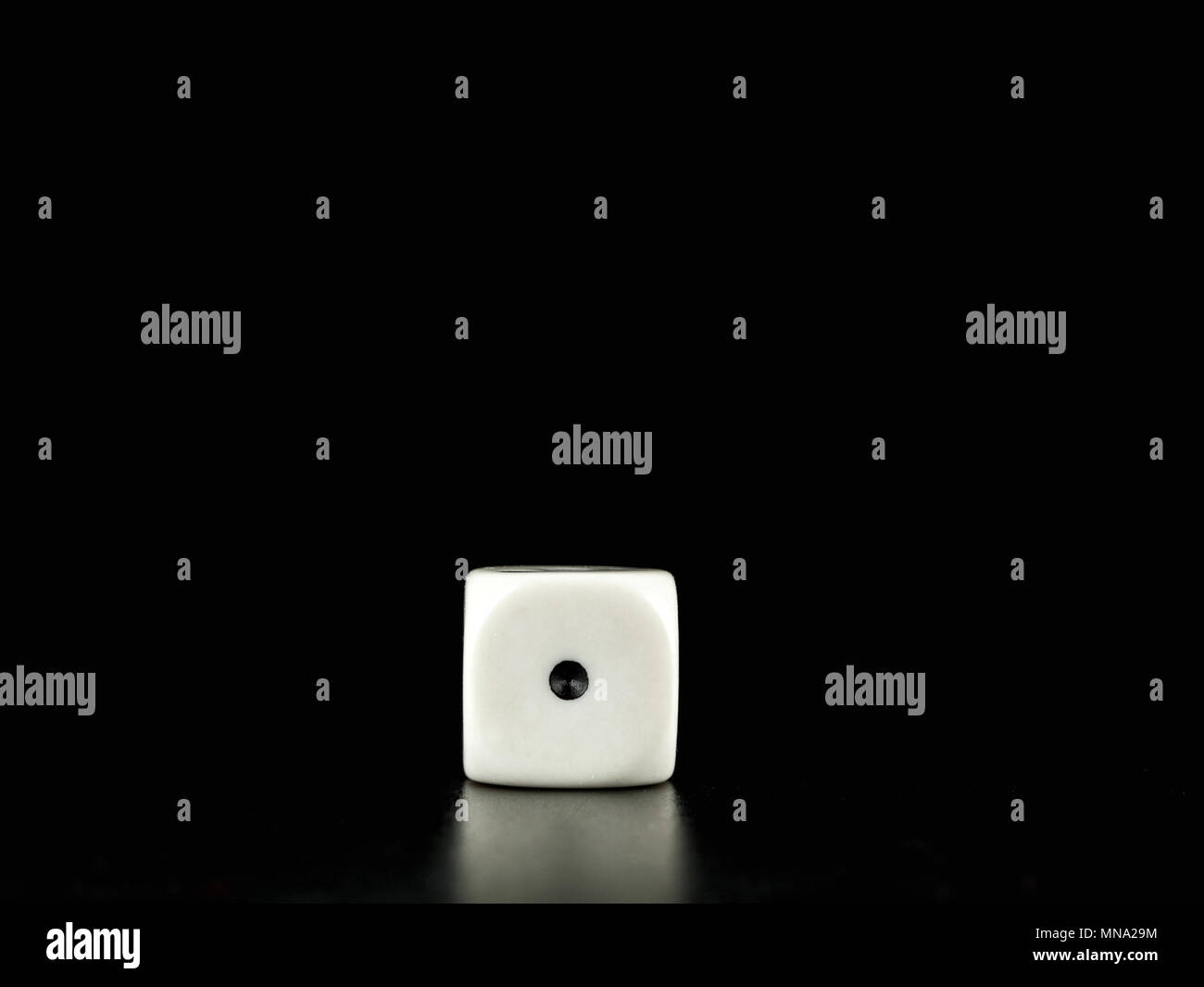 Game die isolated against black background, face with number one Stock ...