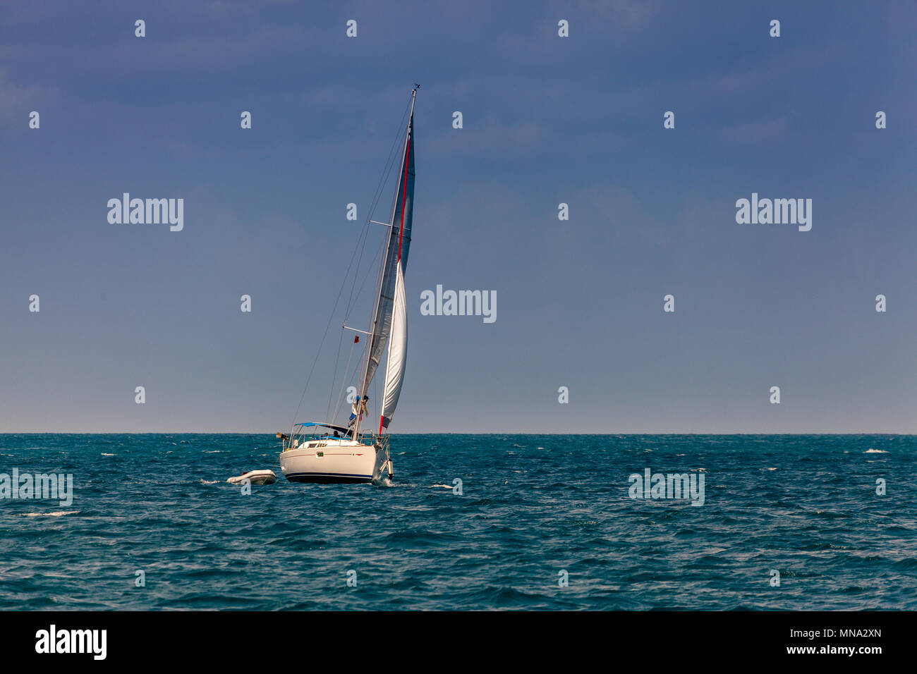 Sailboat on a bright sunny day in an open sea in British Virgin Islands ...
