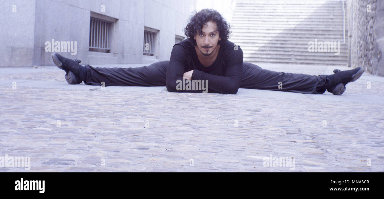 Male dancer in ballet pose. Street background Stock Photo - Alamy