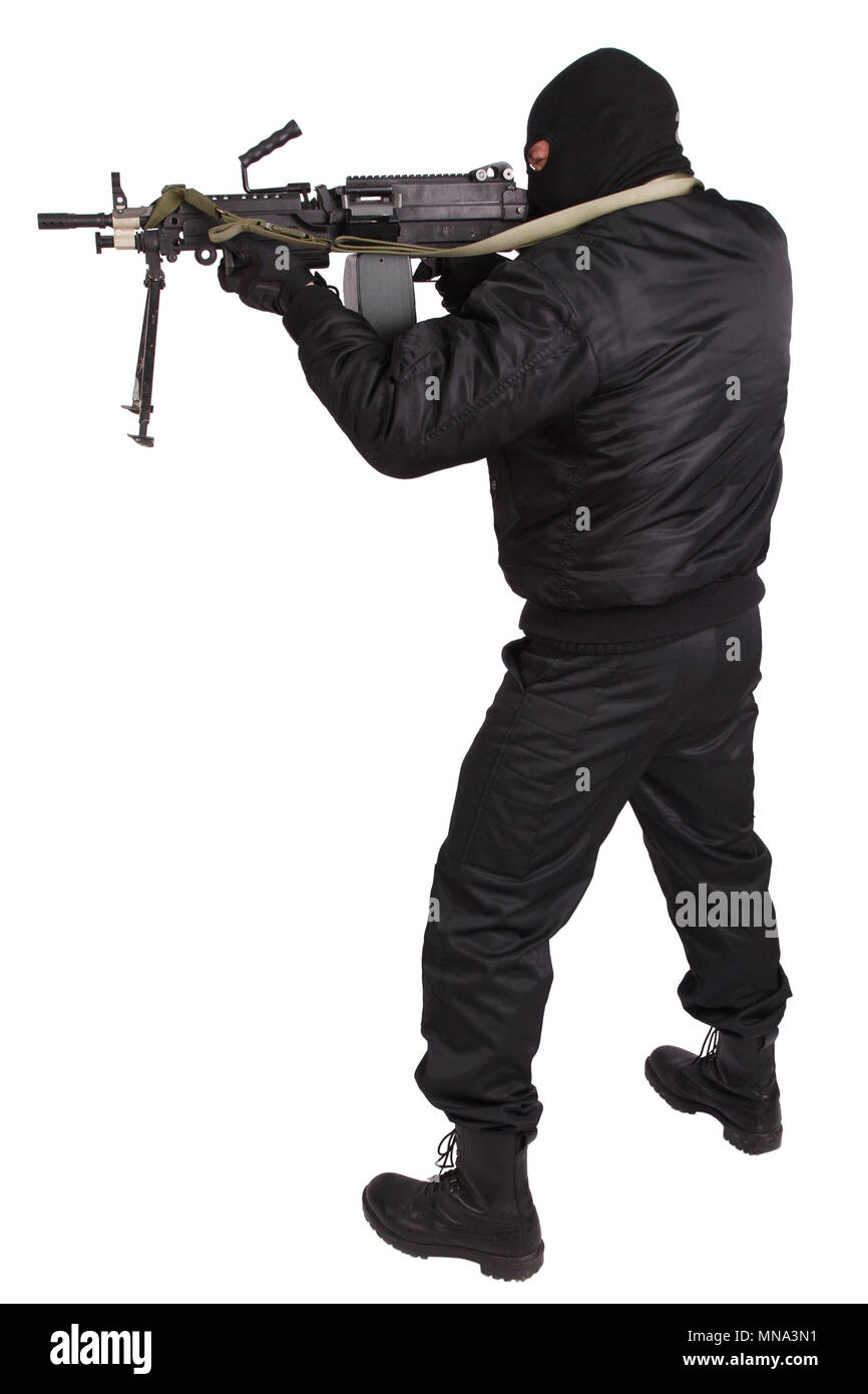 robber in black uniform and mask with machine gun Stock Photo - Alamy