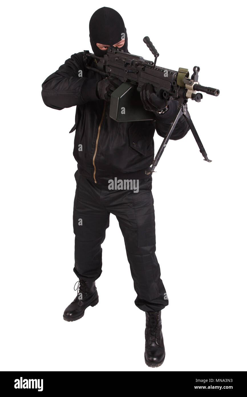 robber in black uniform and mask with machine gun Stock Photo - Alamy