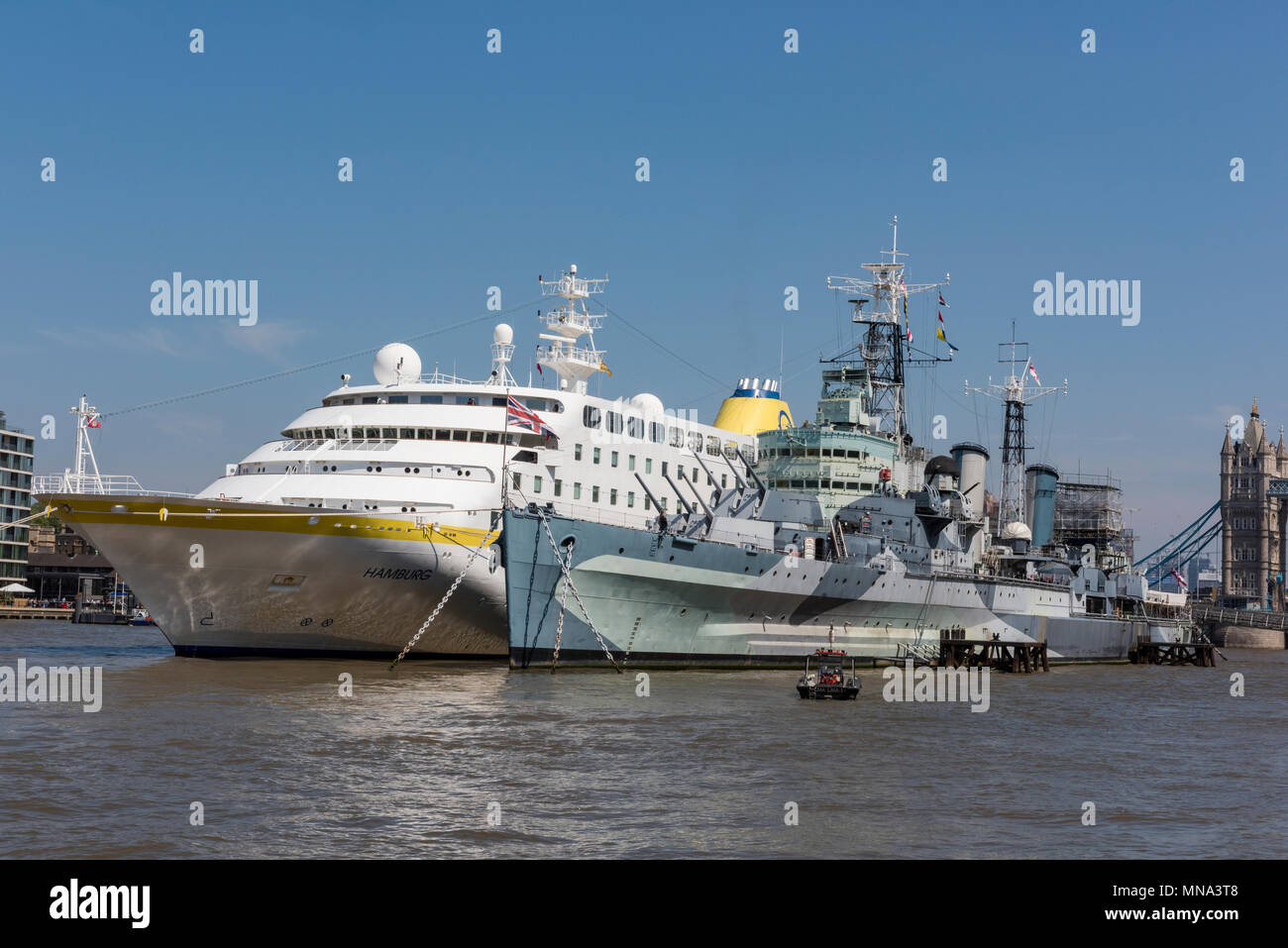 the saga cruises cruise liner ship Hamburg alongside HMS Belfast in the ...