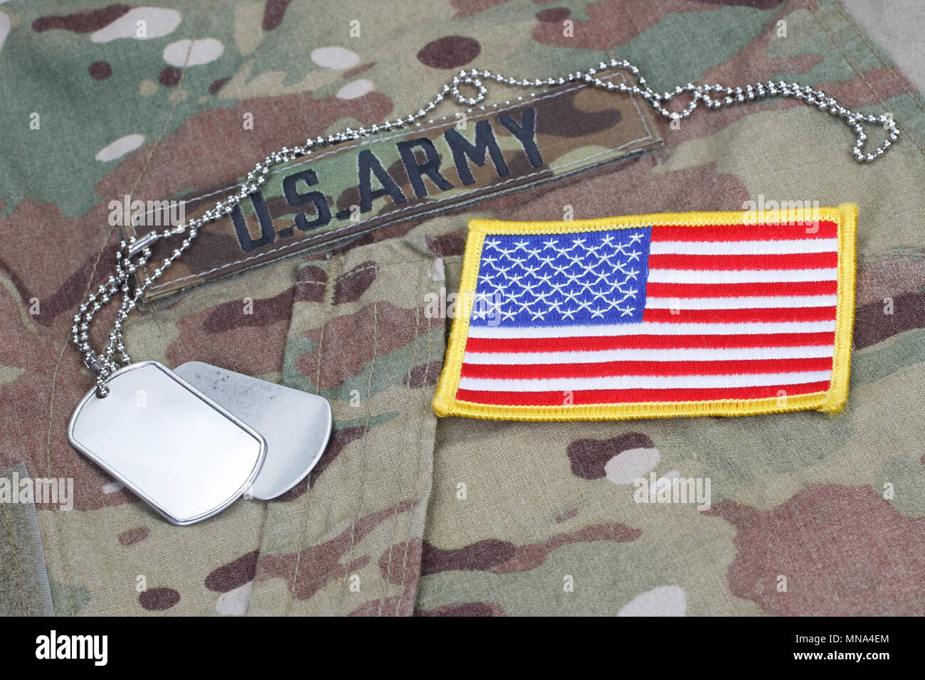 us army camouflaged uniform with US flag patch and blank dog tags Stock ...