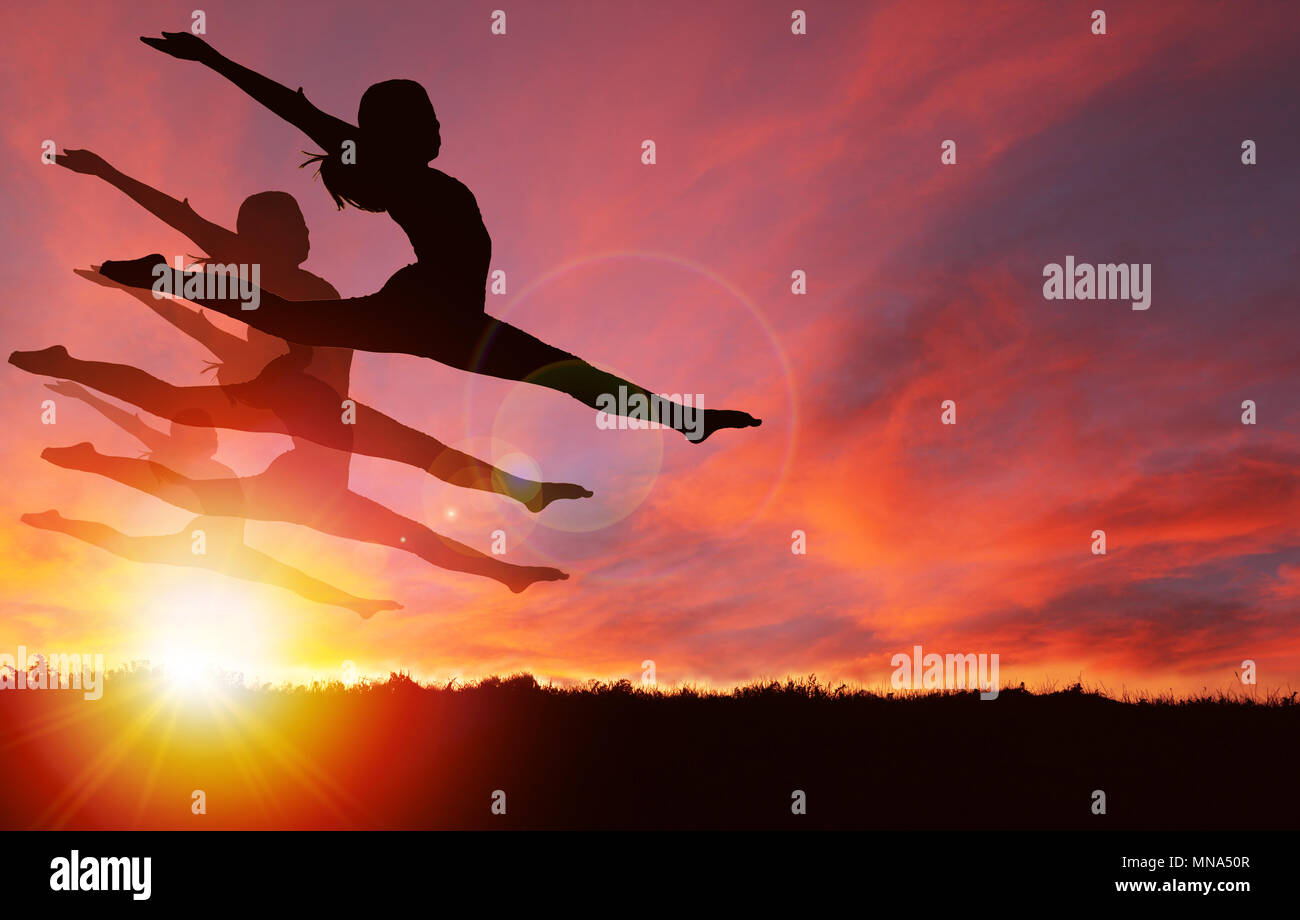 Silhouette of girls dancing and jumping with vibrant golden sunrise or ...