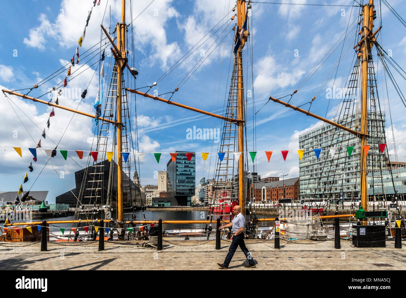 Visitors passing one of the tall ship in Canning Dock Liverpool England ...