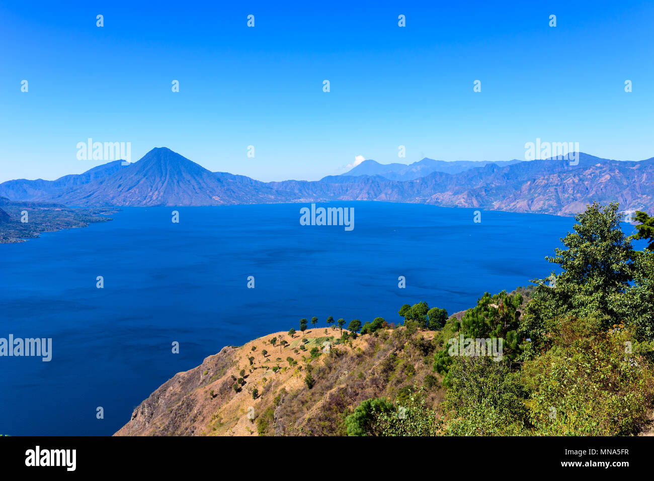 Panorama view of the lake Atitlan and volcanos in the highlands of ...
